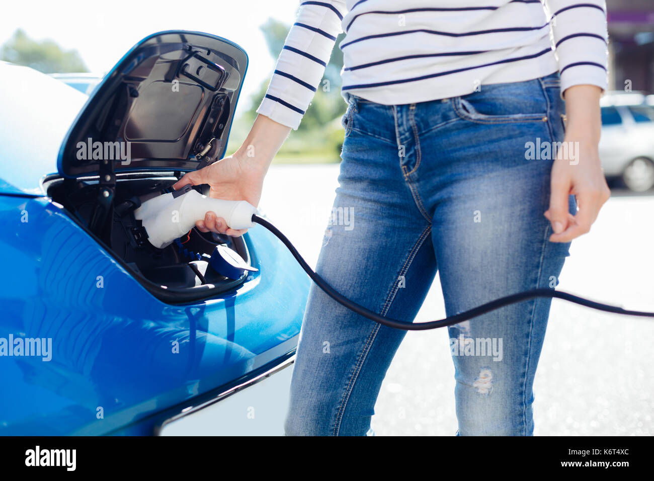 Woman charging electro car hi-res stock photography and images - Alamy