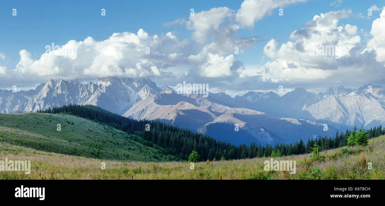 Fantastic snow-capped mountains in the beautiful cumulus clouds ...