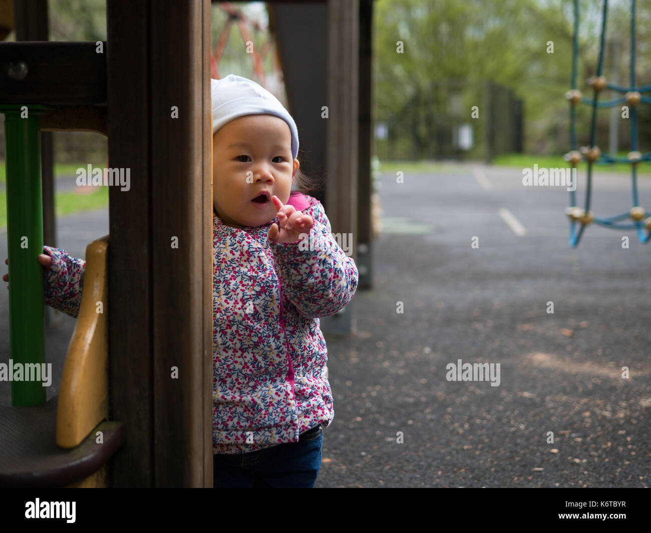 baby girl playing in the playground Stock Photo - Alamy