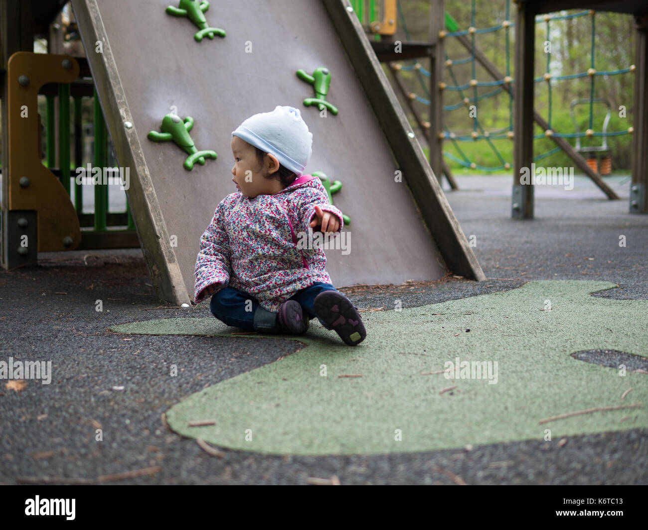 baby girl playing in the playground Stock Photo - Alamy