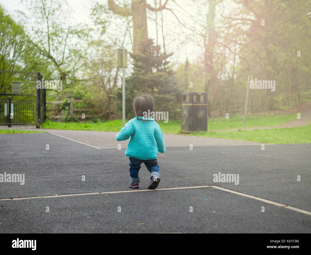baby girl playing in the playground Stock Photo - Alamy