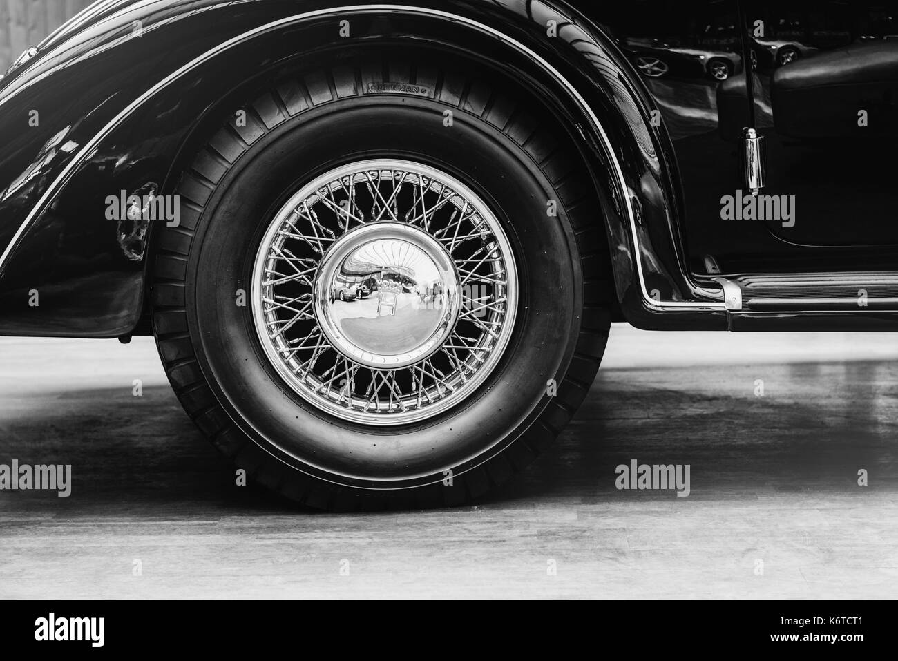 A close up of wheel disk and the side of a vintage automobile Stock ...