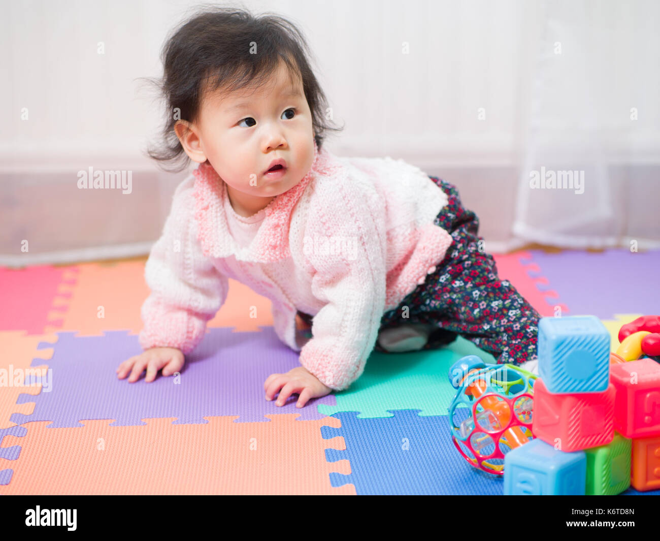 cute baby girl crawl on the floor Stock Photo - Alamy