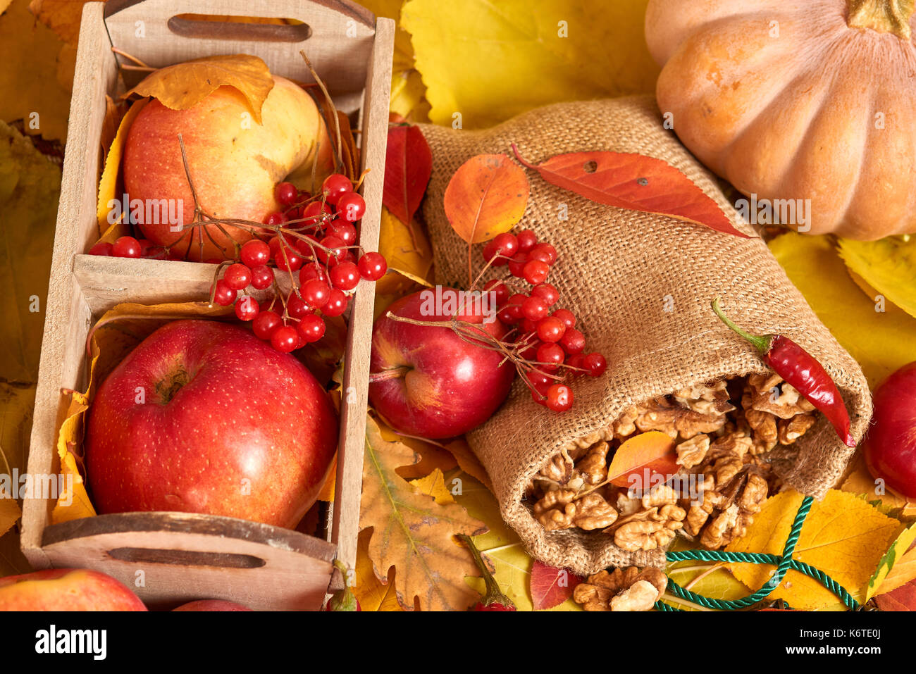 Fruits and vegetables on fallen leaves background, autumn season Stock ...