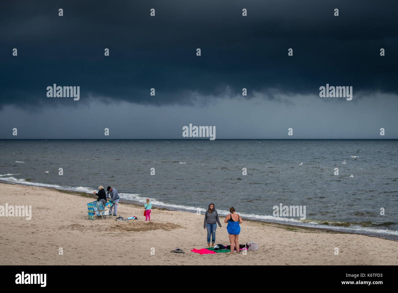 Sarbinowo, Poland - August 2017 : Tourists leaving the Baltic sea beach ...