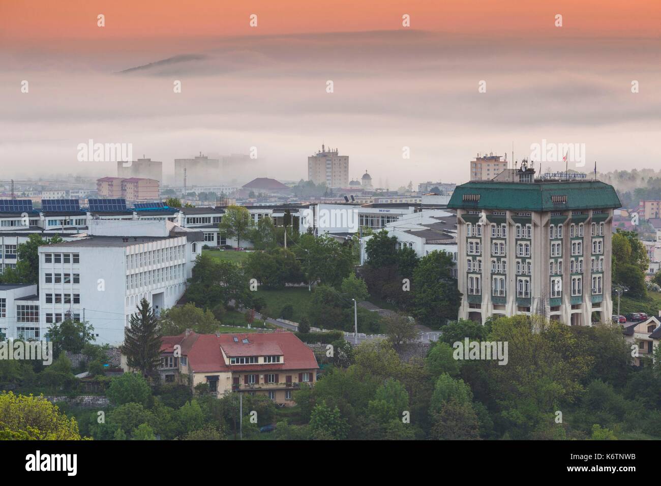 Romania, Transylvania, Brasov, new city buildings and fog, dawn Stock ...