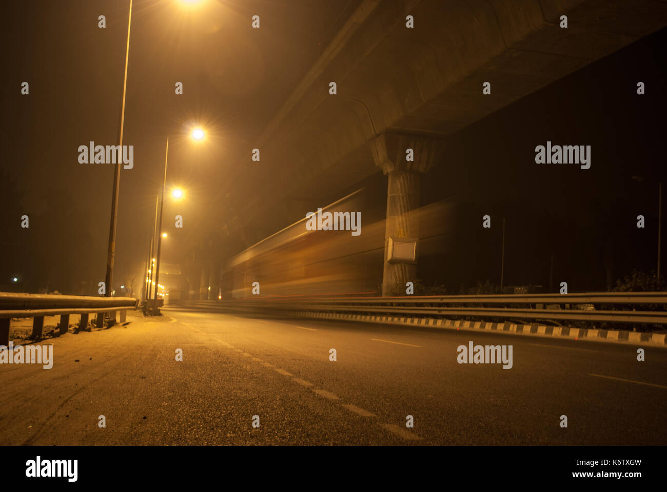 Empty road at night Stock Photo - Alamy
