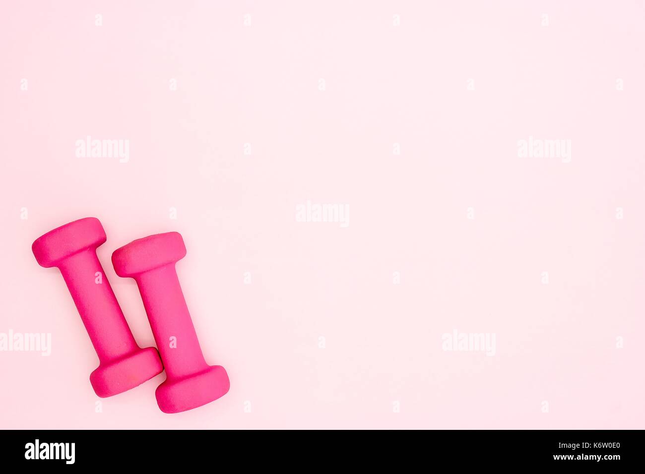 A studio photo of pink dumbells Stock Photo - Alamy