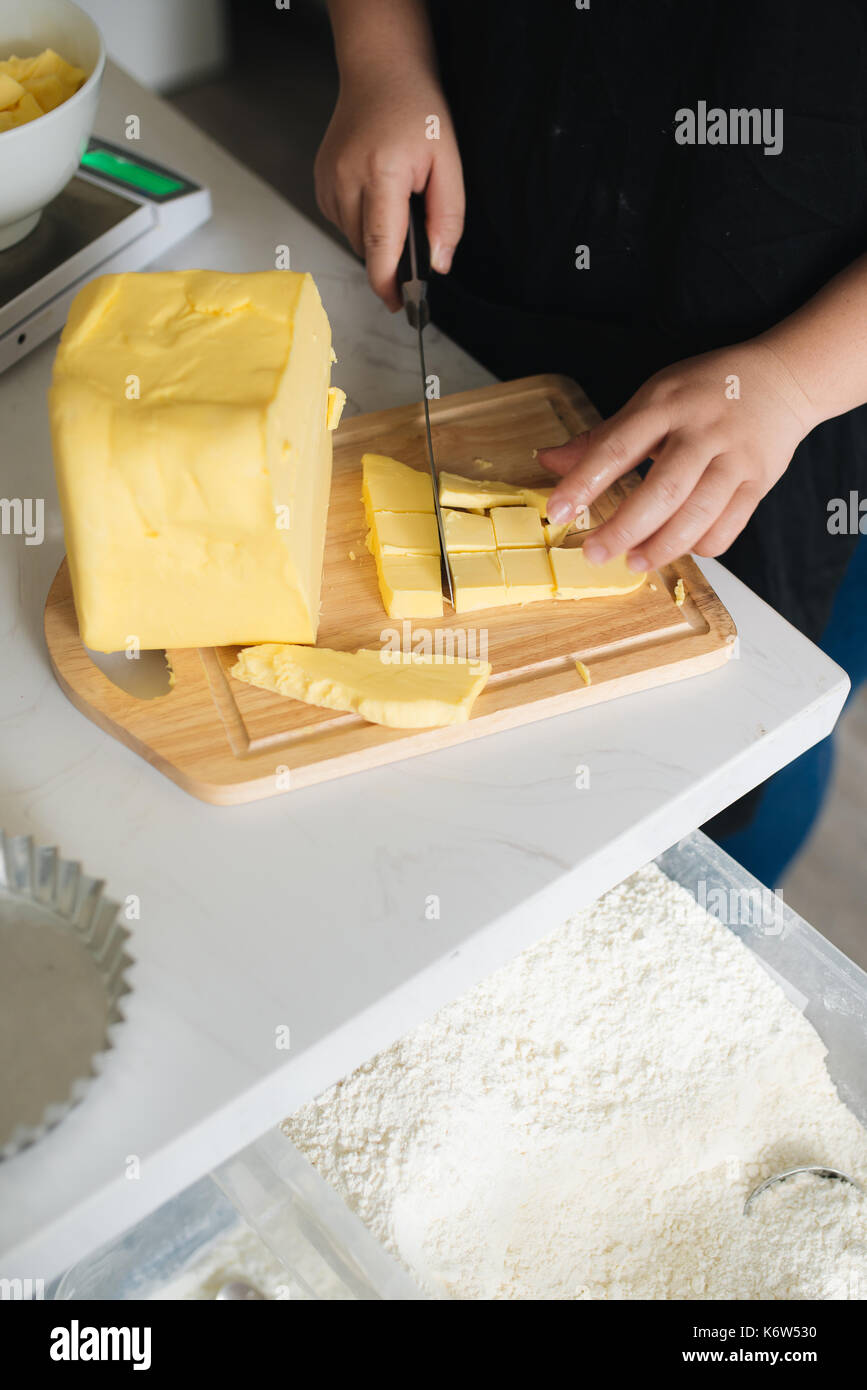 Bakery chef mixing butter in the kitchen professional Stock Photo - Alamy