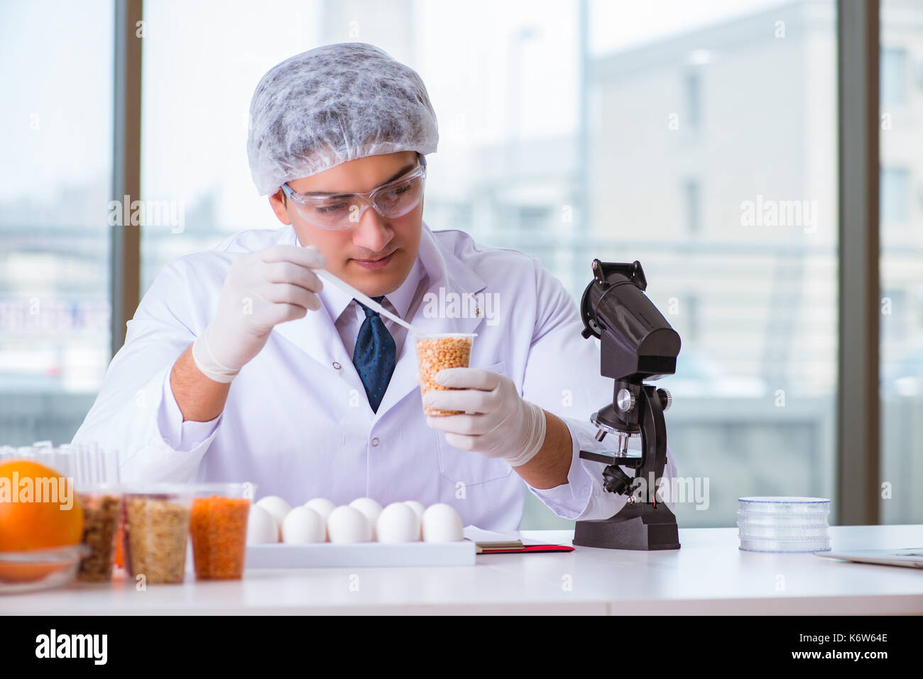 Nutrition expert testing food products in lab Stock Photo - Alamy