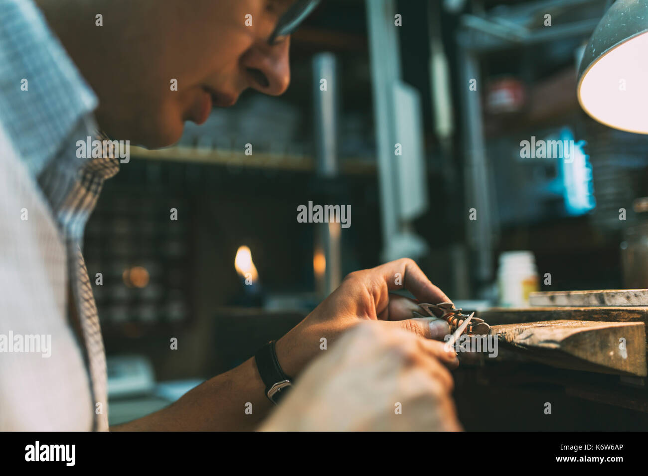 Jeweler polishing jewelry Stock Photo - Alamy