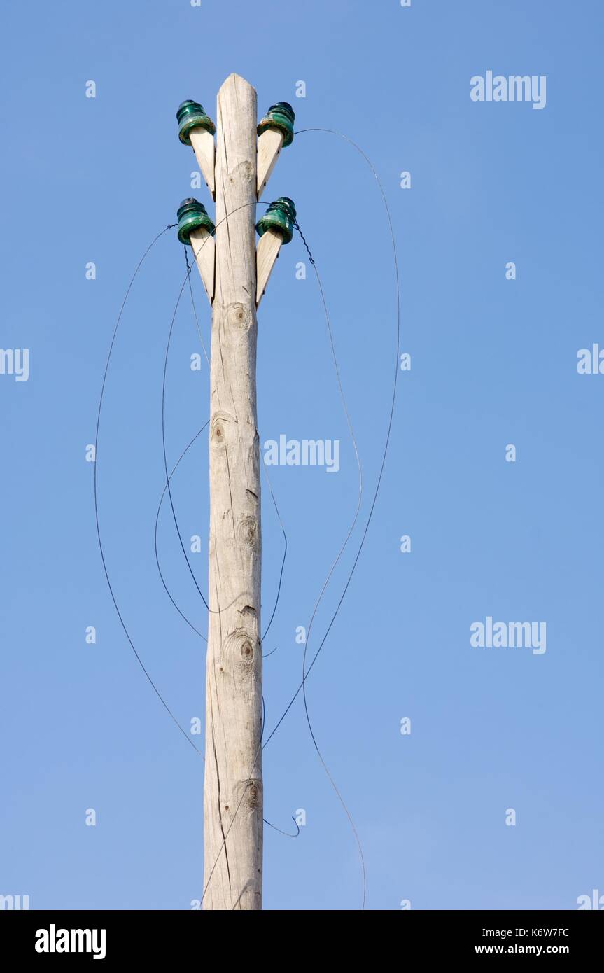 Wooden pylon with blue sky Stock Photo - Alamy