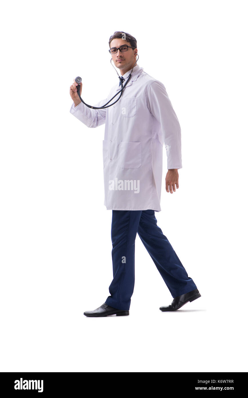 Young doctor physician standing walking isolated on white background ...
