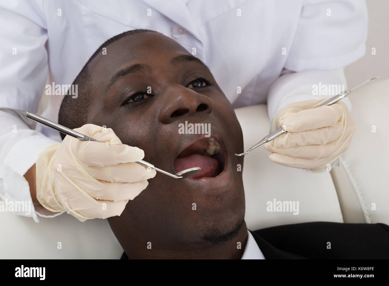 African Dentist Caucasian High Resolution Stock Photography and Images ...