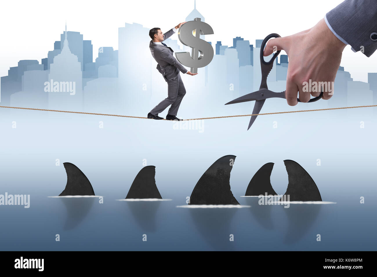 Hand cutting rope in business risk concept Stock Photo - Alamy