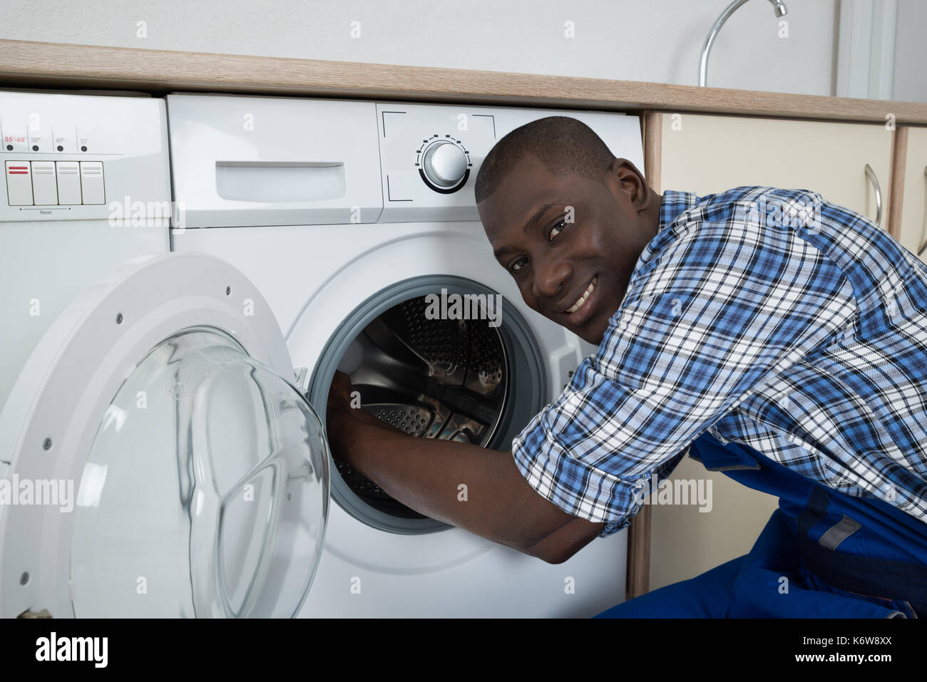 African washing hi-res stock photography and images - Alamy