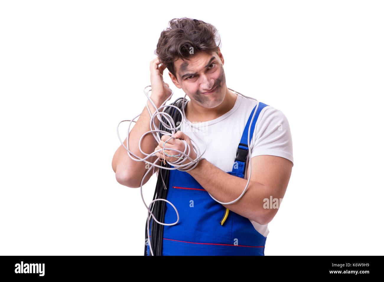 Funny man doing electrical repair Stock Photo - Alamy