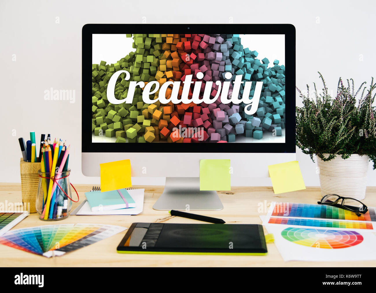 Stationery desktop with design stuff, computer and graphic tablet ...