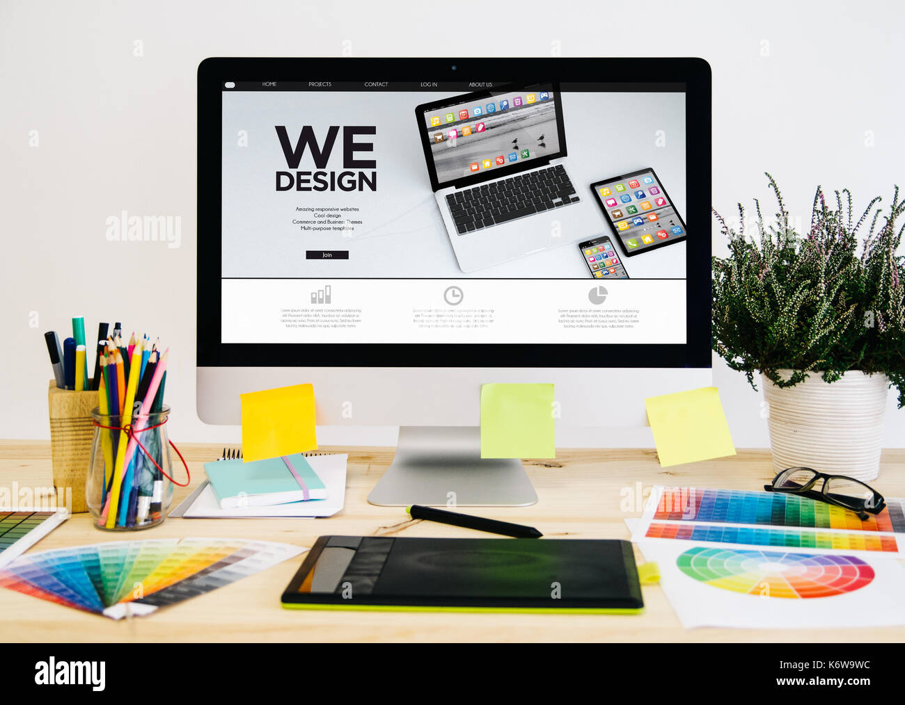 Stationery desktop with design stuff, computer and graphic tablet ...