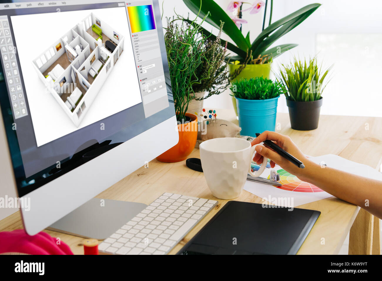 Graphic designer designing an interior home using pen tablet. All ...