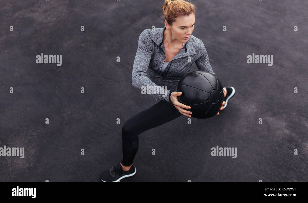 Core strength and stability workout. Fit young woman exercising ...