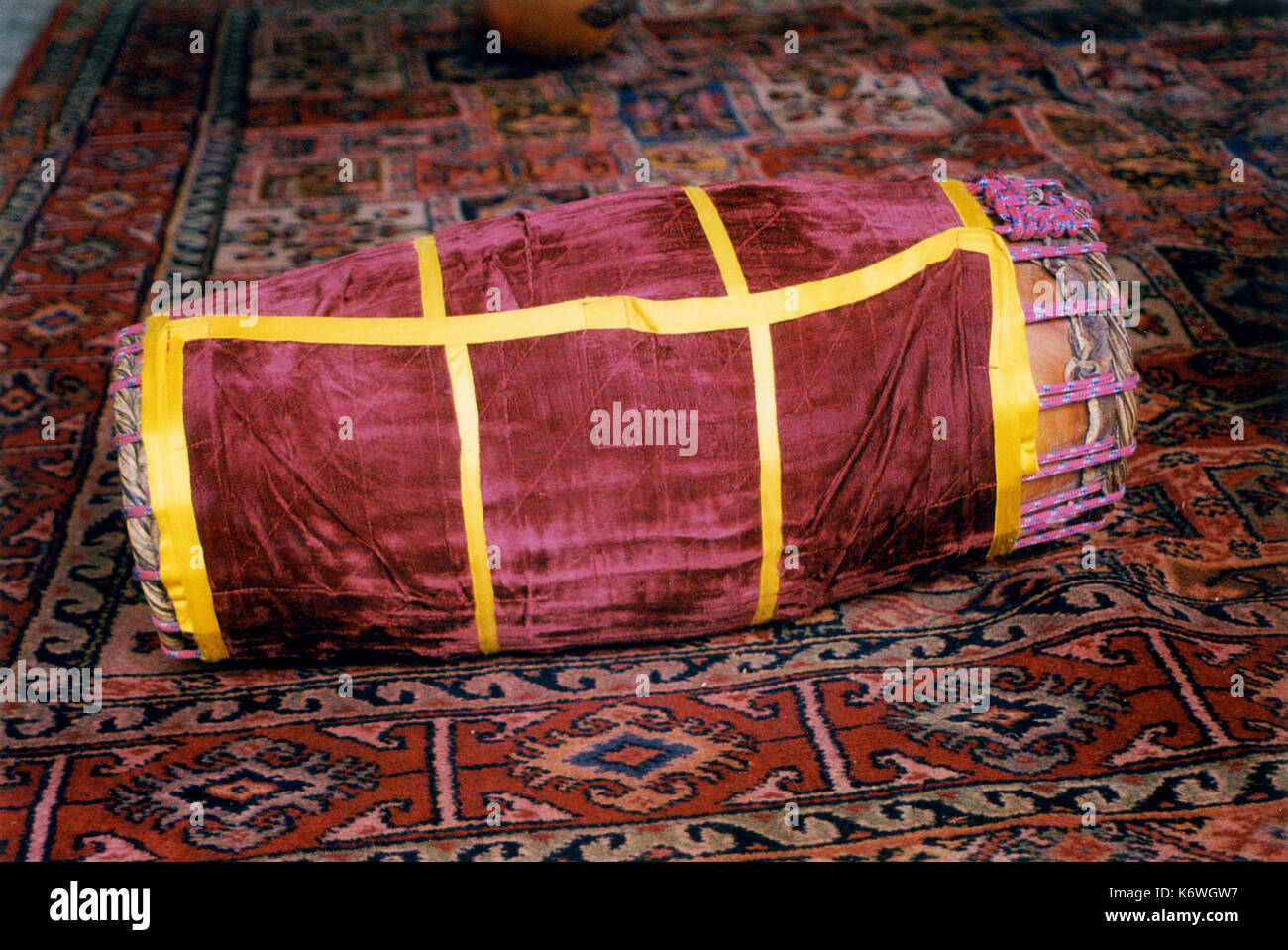 Mridangam, instrument from India- view of body wrapped in velvet cloth ...