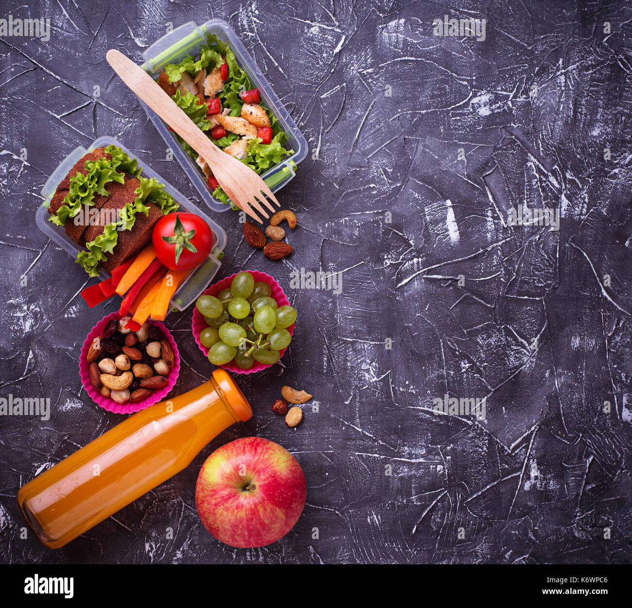 School lunch. Salad, sandwiches, fruits and nuts Stock Photo - Alamy