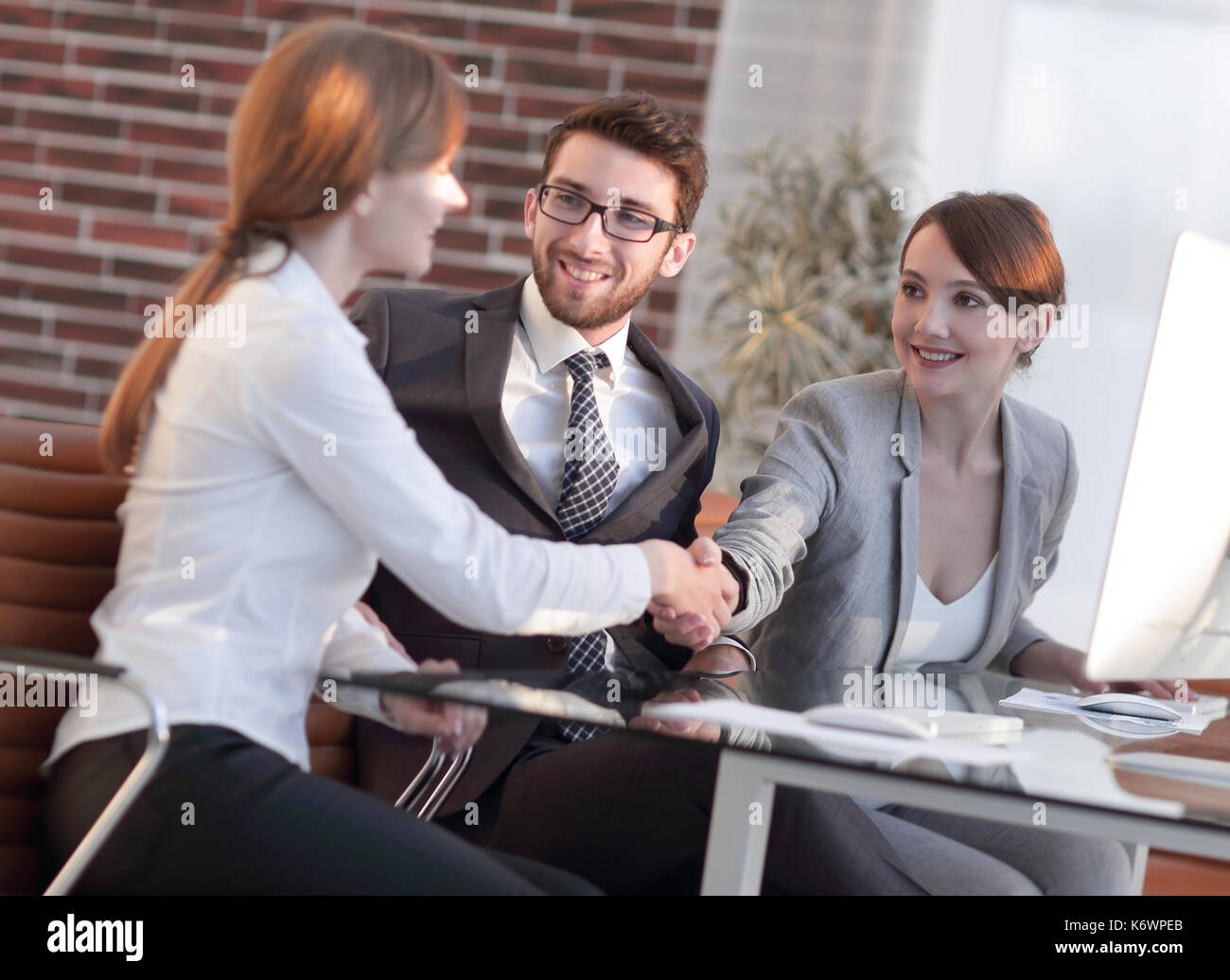 business woman greets the employee with a handshake Stock Photo - Alamy