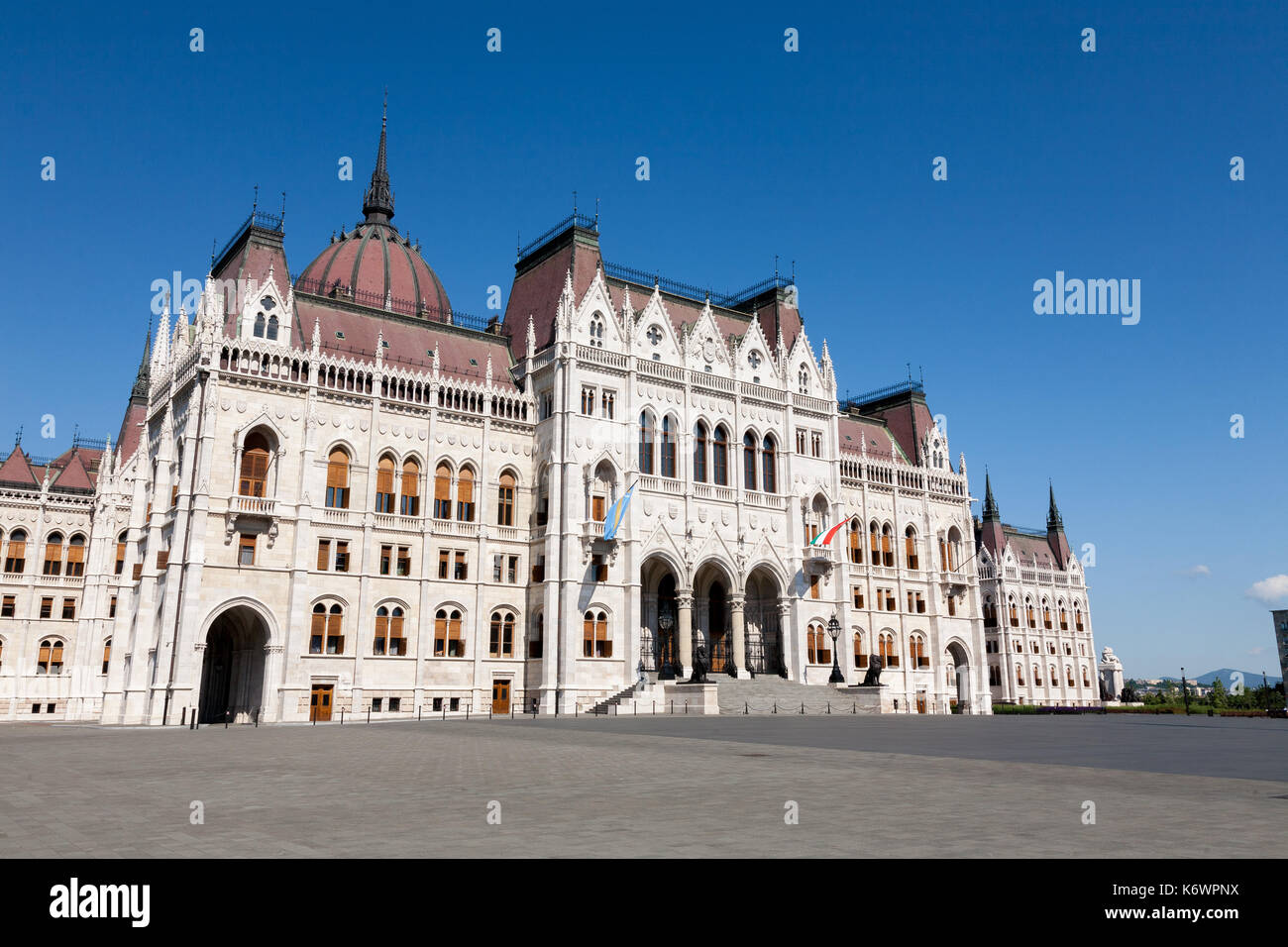 The facade of the immense white marble building of the neo-gothic ...