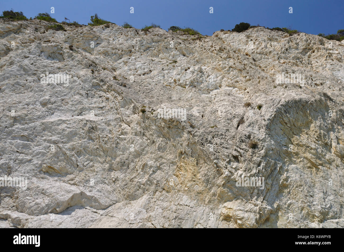 Eroded rock surface steep cliff steep slope background Stock Photo - Alamy