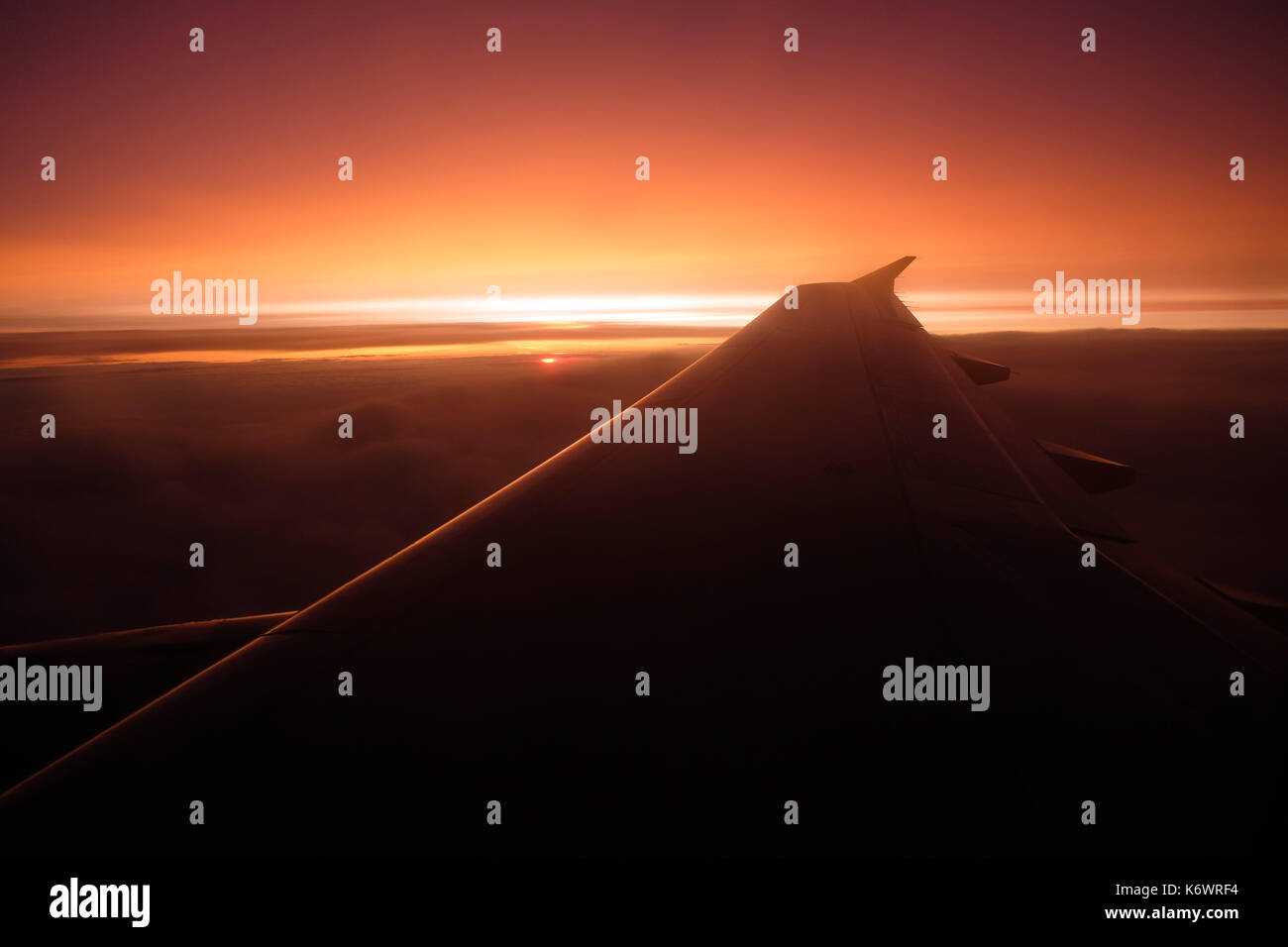 Sunset over a plane wing Stock Photo - Alamy