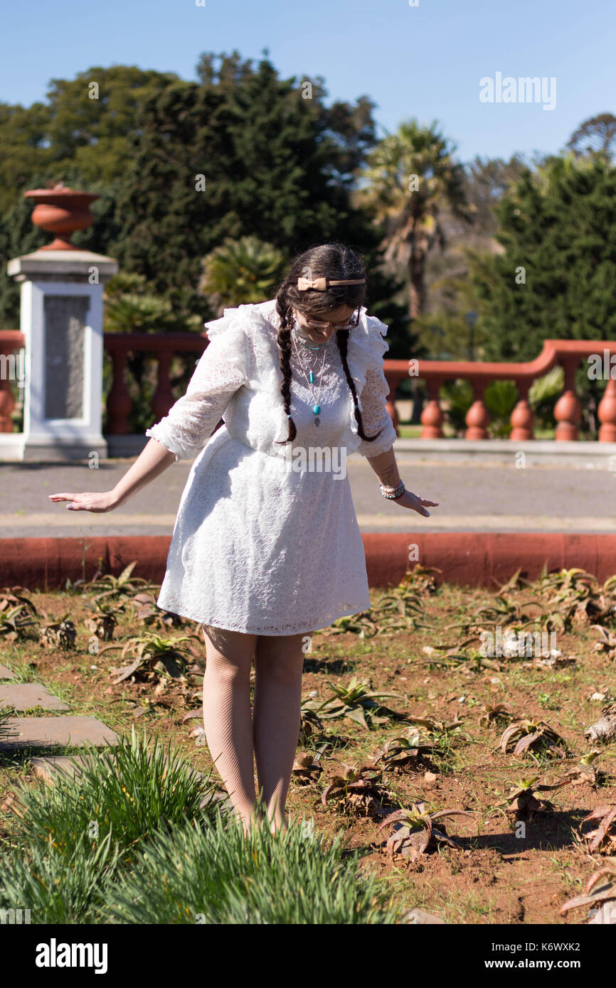Girl looking at her toes Stock Photo - Alamy