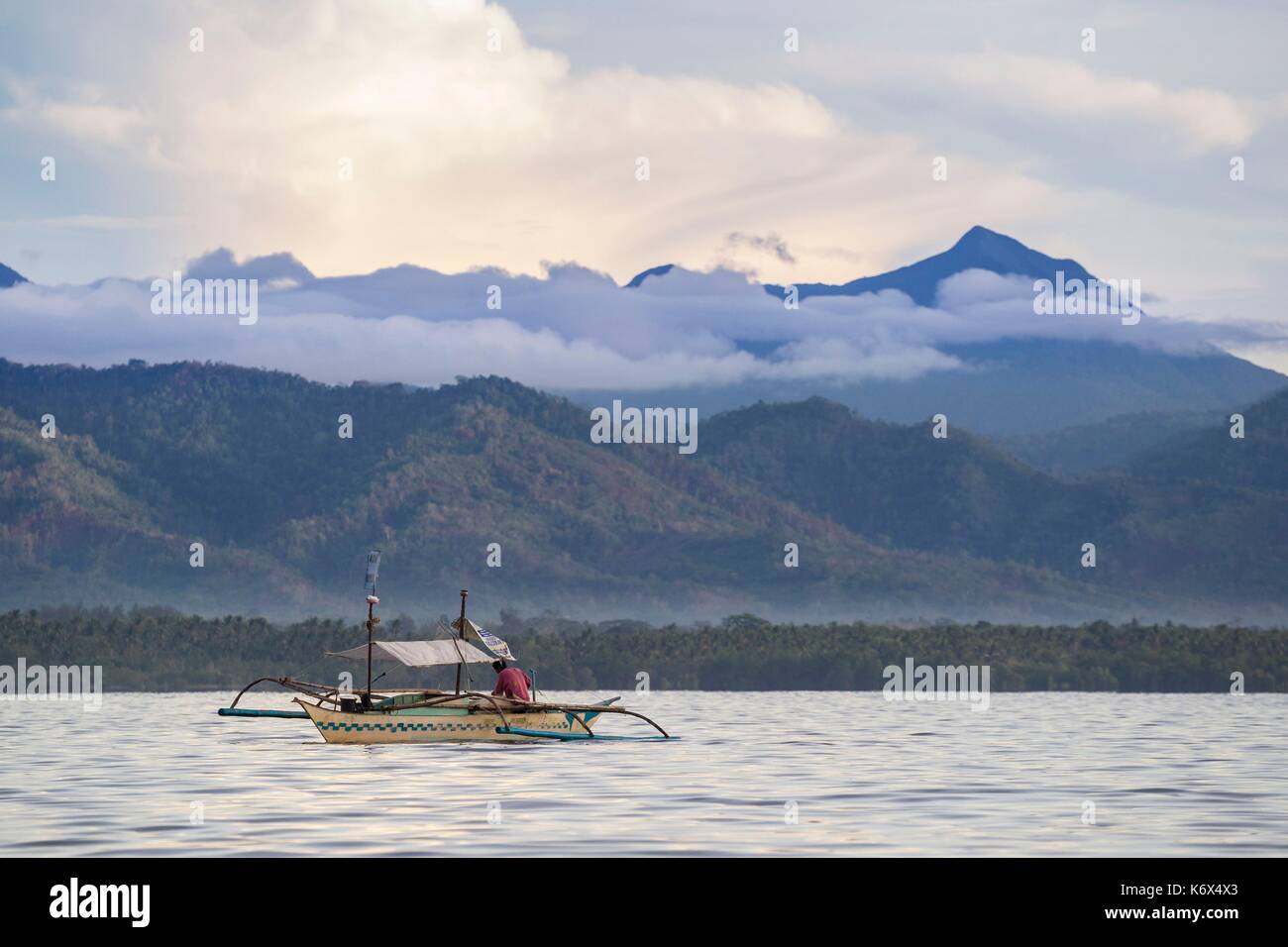 Philippines, Palawan, Aborlan, Sombrero Island, fisherman on his boat ...