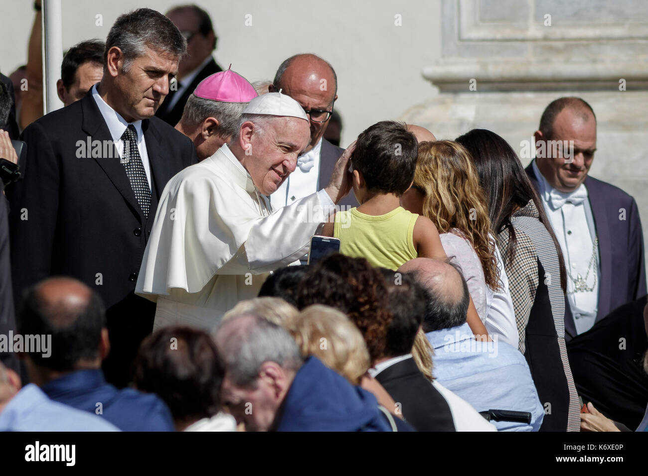 Vatican City, Vatican. 13th Sep, 2017. Pope Francis greets a baby as he ...