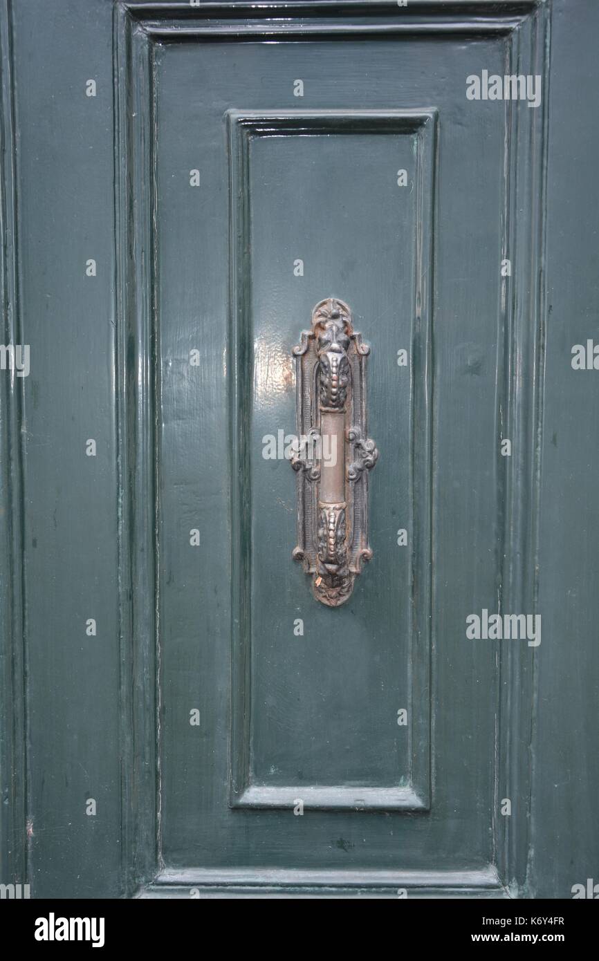 Detail of an old door from the front with antique metal clutch in the ...