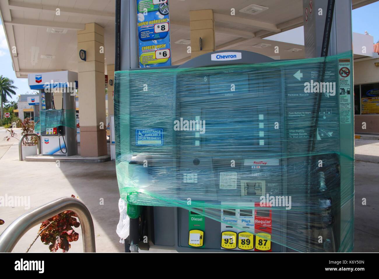Chevron Gas Station with Pumps Covered in Transparent Green Plastic ...