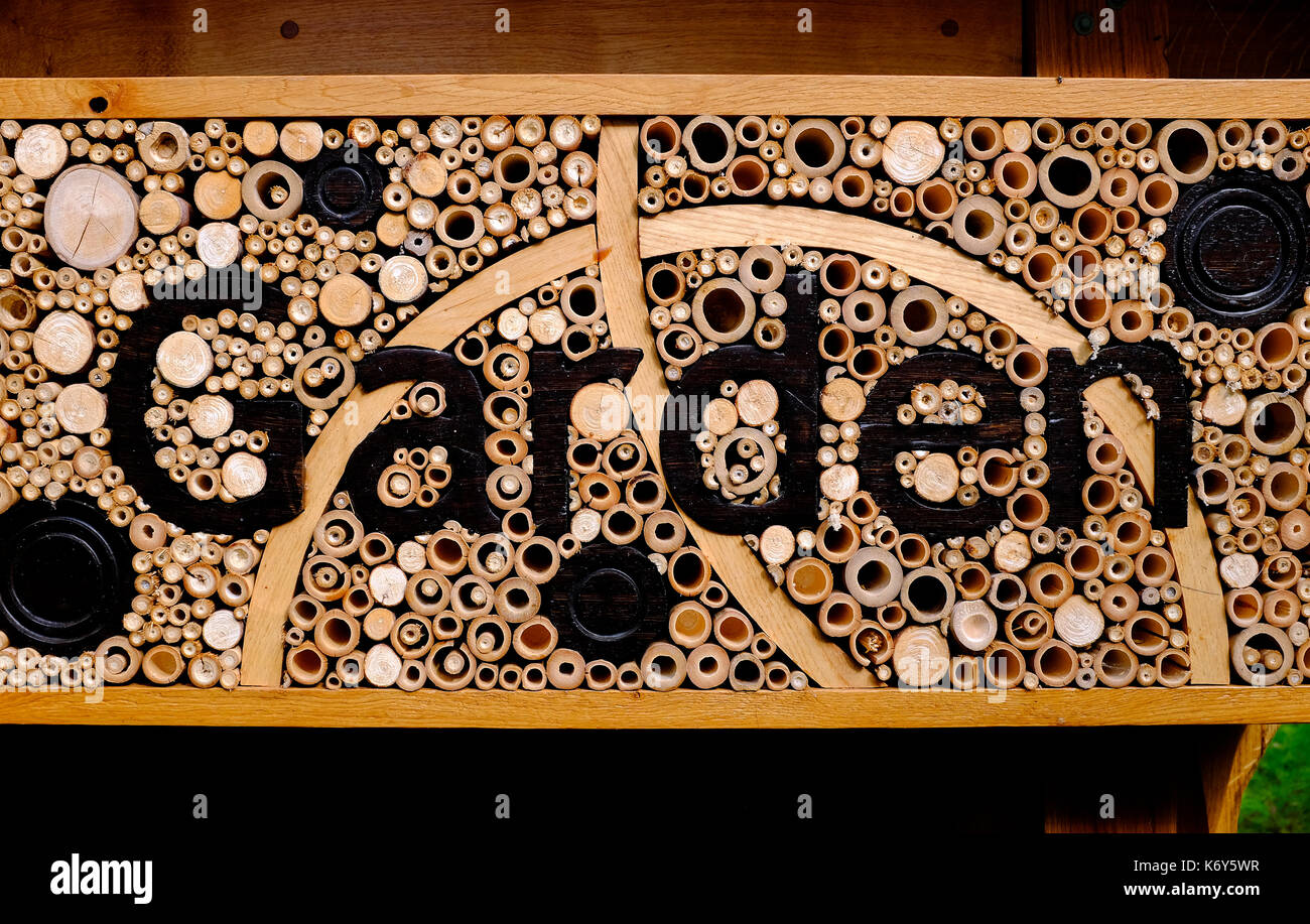 bug hotel garden sign Stock Photo - Alamy