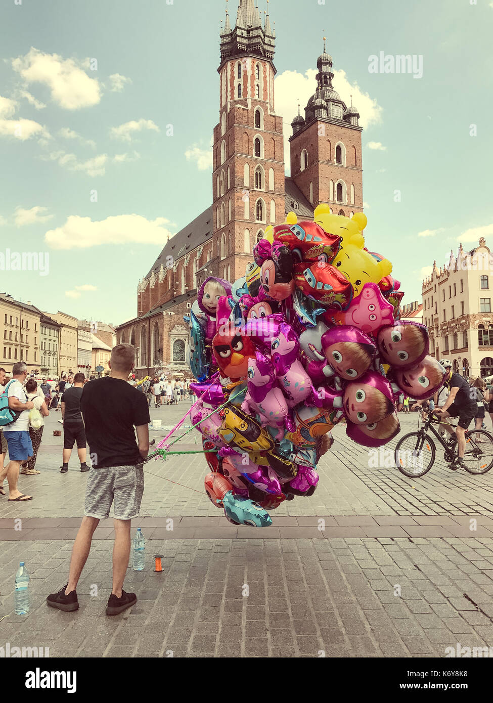 Male street vendor sells colorful popular cartoon character heli Stock ...