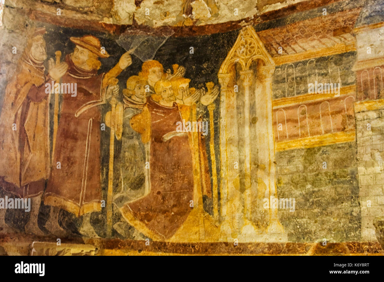Medieval mural of pilgrims on the wall of a small roman church in ...