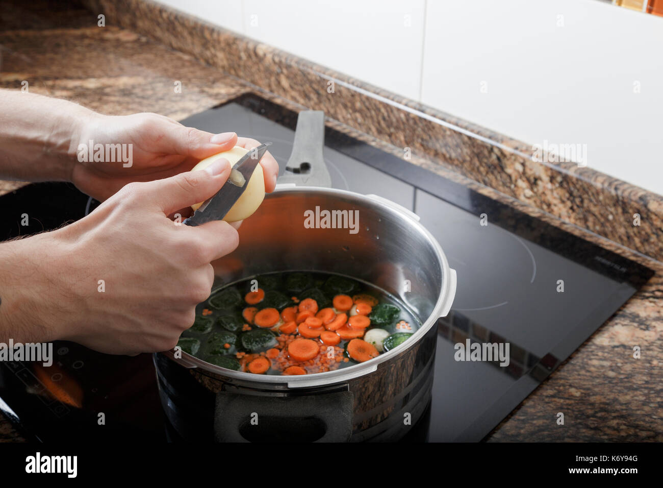 Induction cooking male hi-res stock photography and images - Alamy