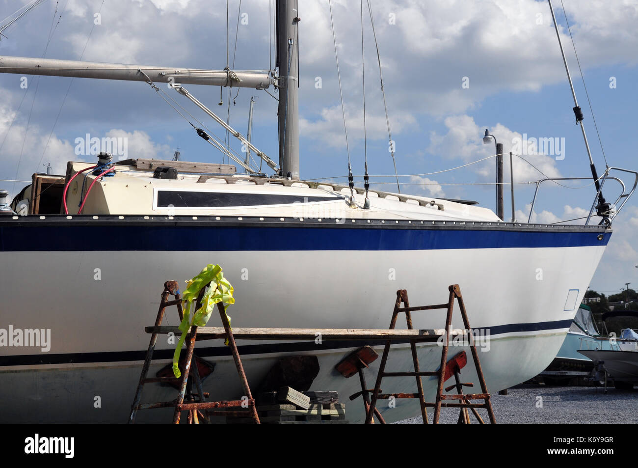 Sailboat at Dry Dock getting ready for repairs Stock Photo - Alamy