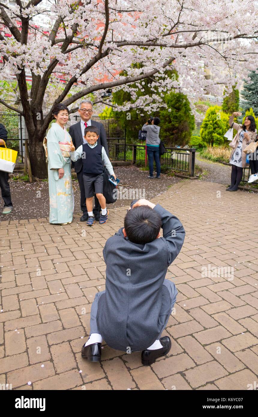 Japan, Tokyo, Shibuya district, family celebrating their eldest son's ...