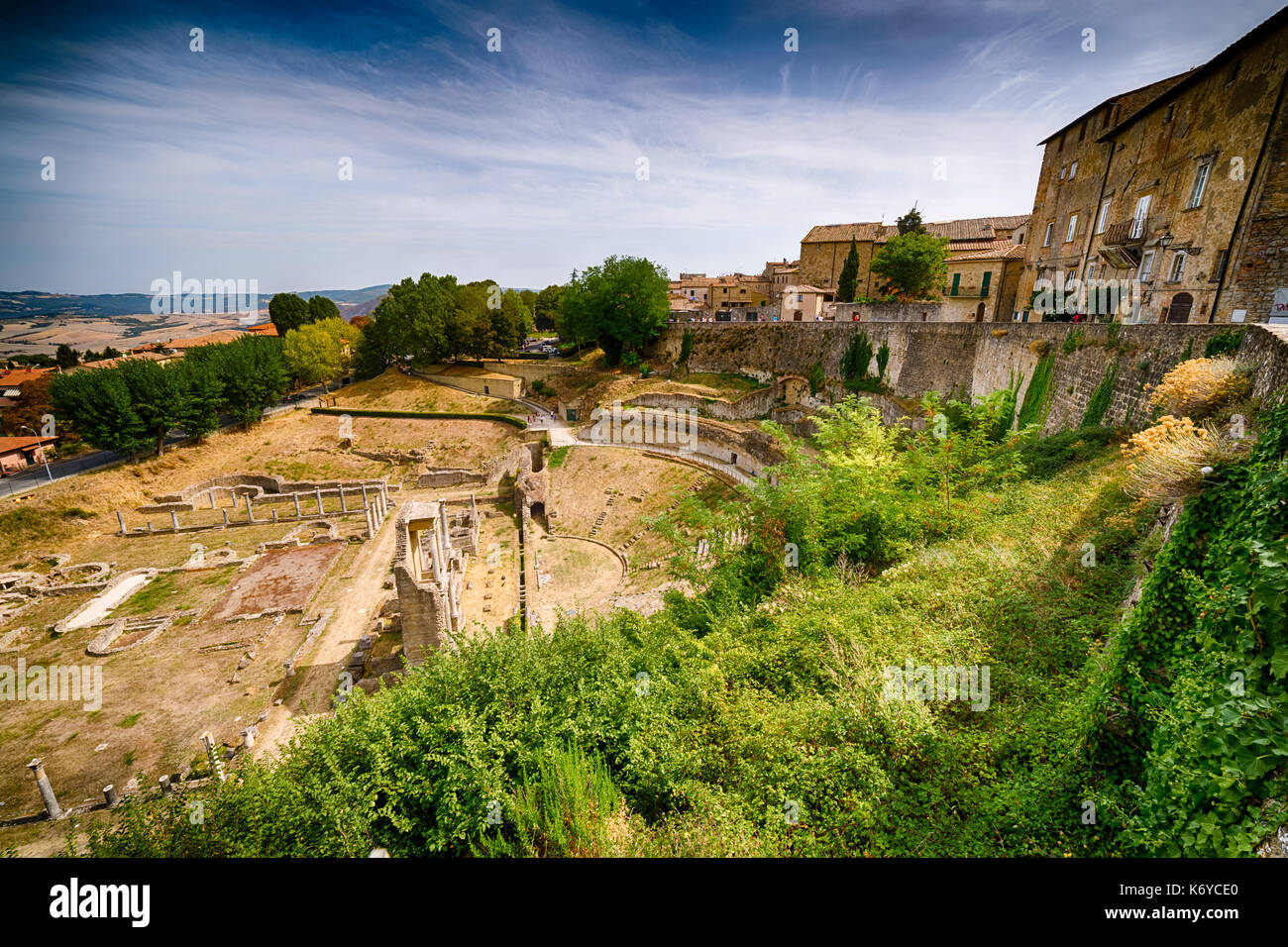 view of Roman ruins in Volterra, a time travel through the roofs of the ...