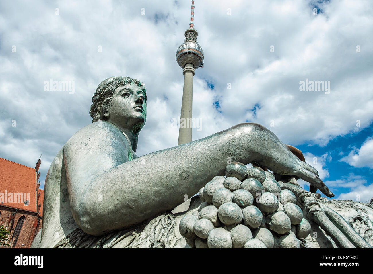 Germany A statue of the Neptunbrunnen (fontain of Neptune) with the tv ...