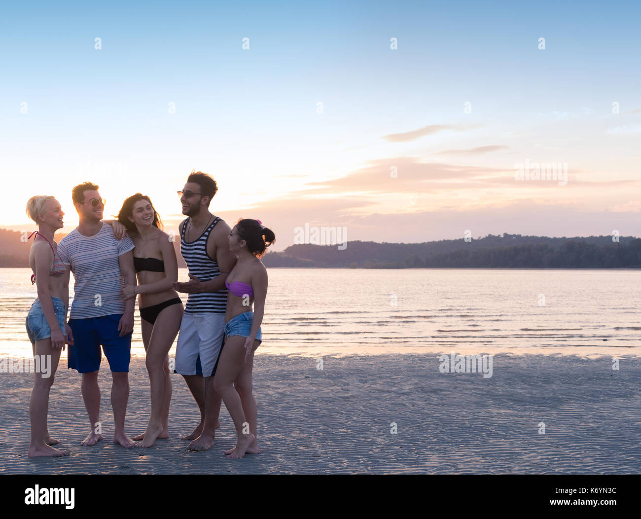 Young People Group On Beach At Sunset Summer Vacation, Happy Smiling ...