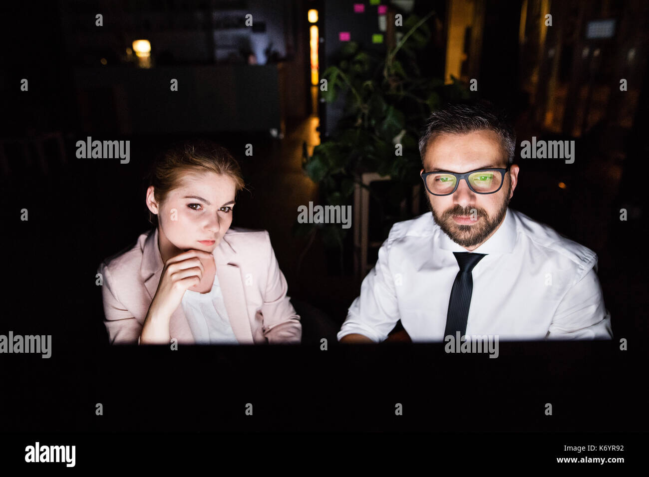 Business people in the office at night working late Stock Photo - Alamy