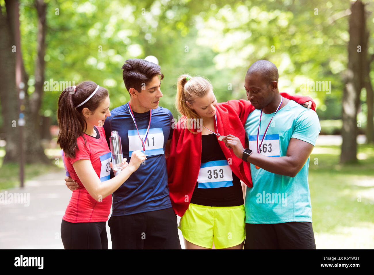 Group of young fit friends happy after finishing race Stock Photo - Alamy