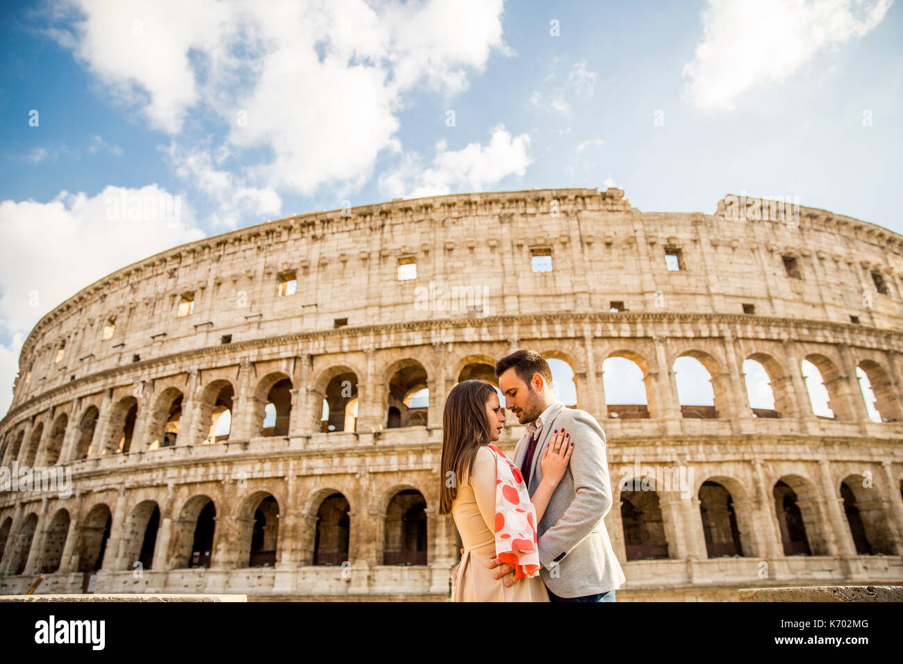 Happy couple hugging in front of Colosseum in Rome, Italy Stock Photo ...