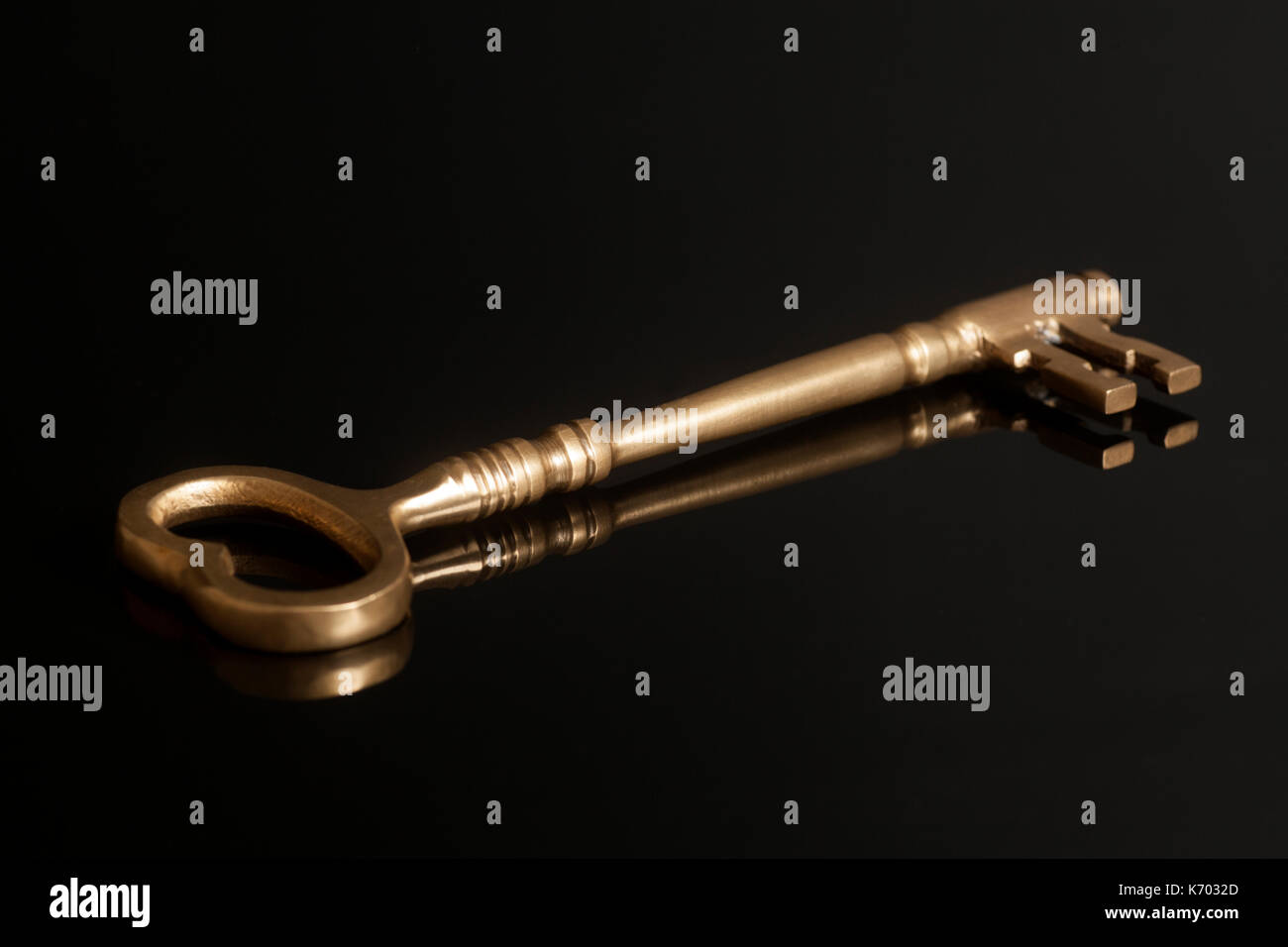 Vintage Key on black background Stock Photo - Alamy