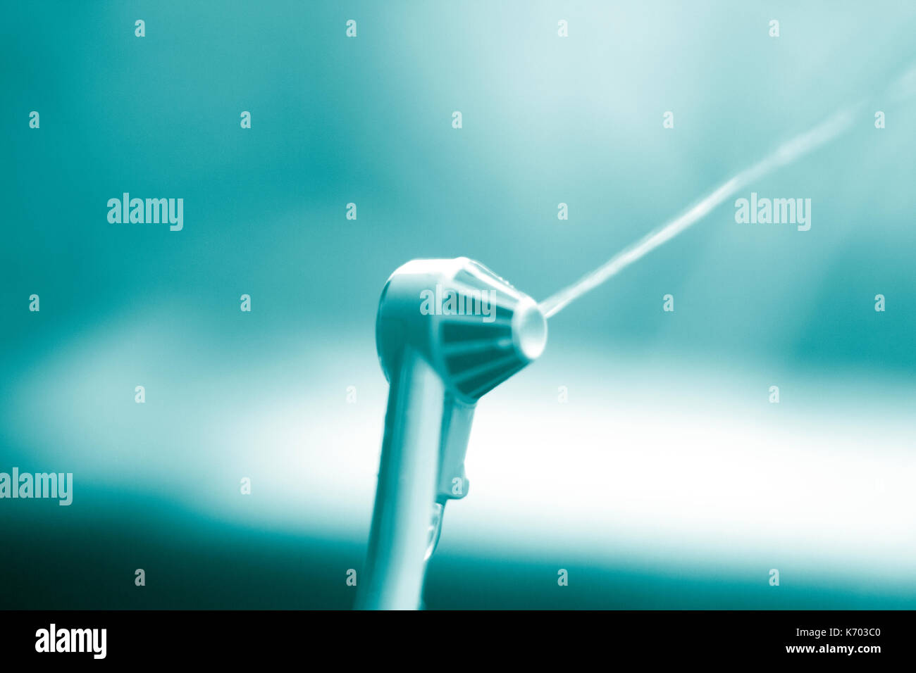 Dental water spray cleaner for interdental hygiene Stock Photo - Alamy